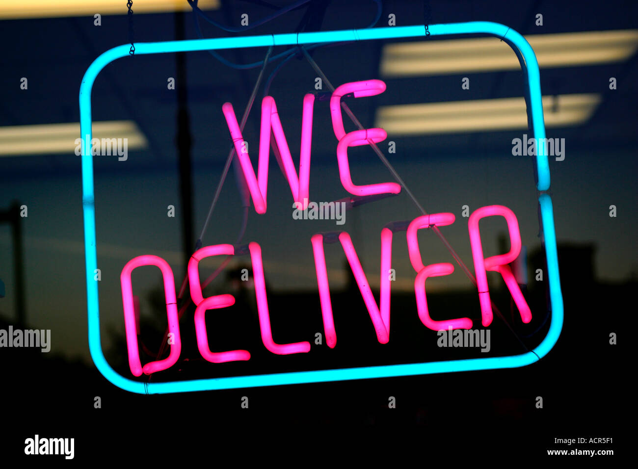 We Deliver Neon Sign Stock Photo: 2455024 - Alamy