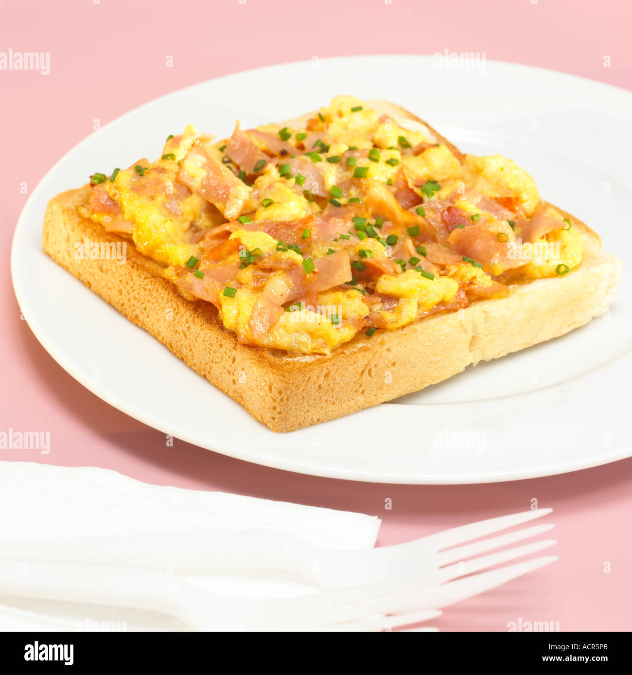 Toast with scrambled eggs and ham Stock Photo - Alamy