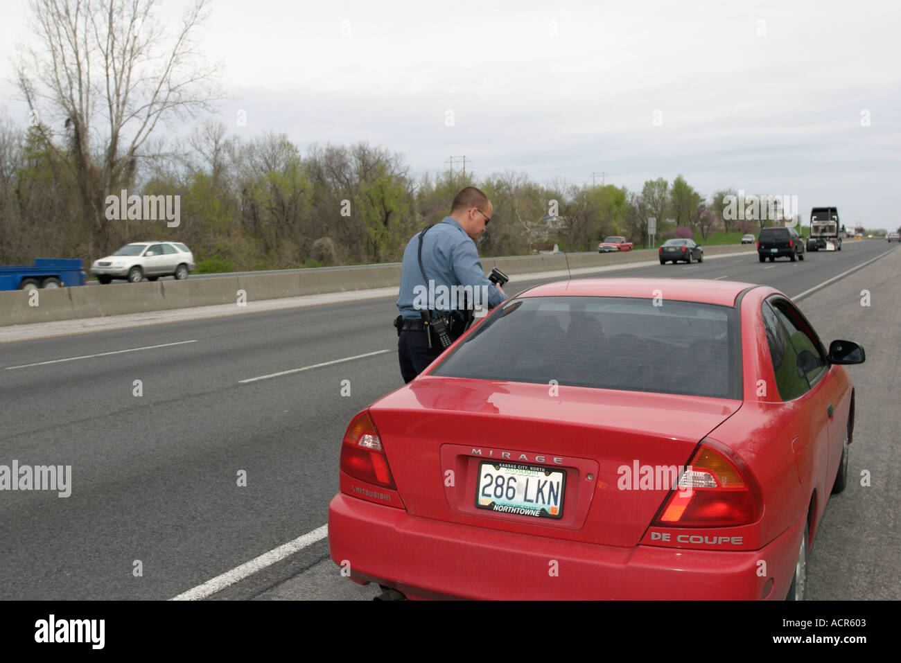 Police conducting traffic stop. Officer talking to driver stopped for ...