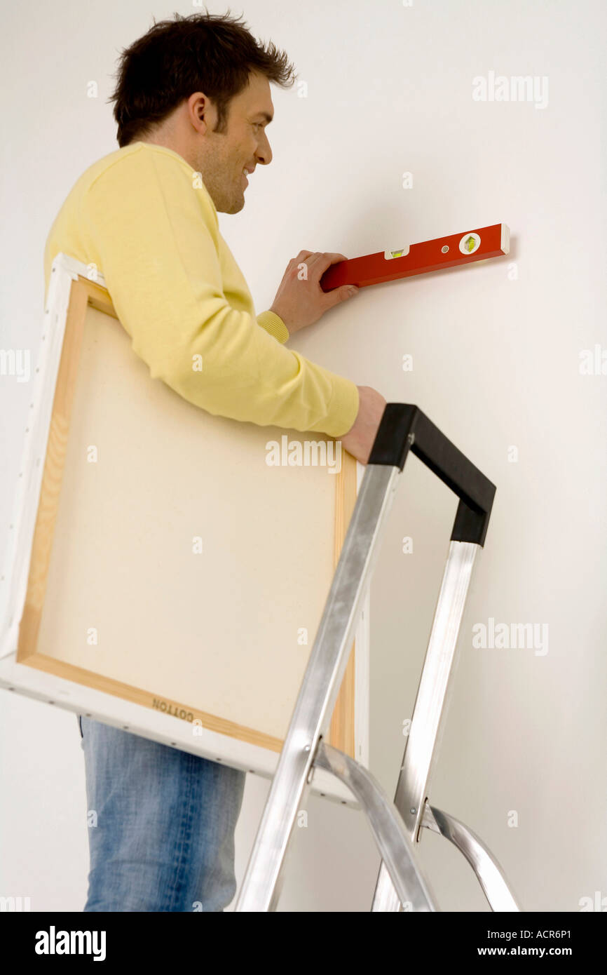 Man on ladder changing hi-res stock photography and images - Alamy