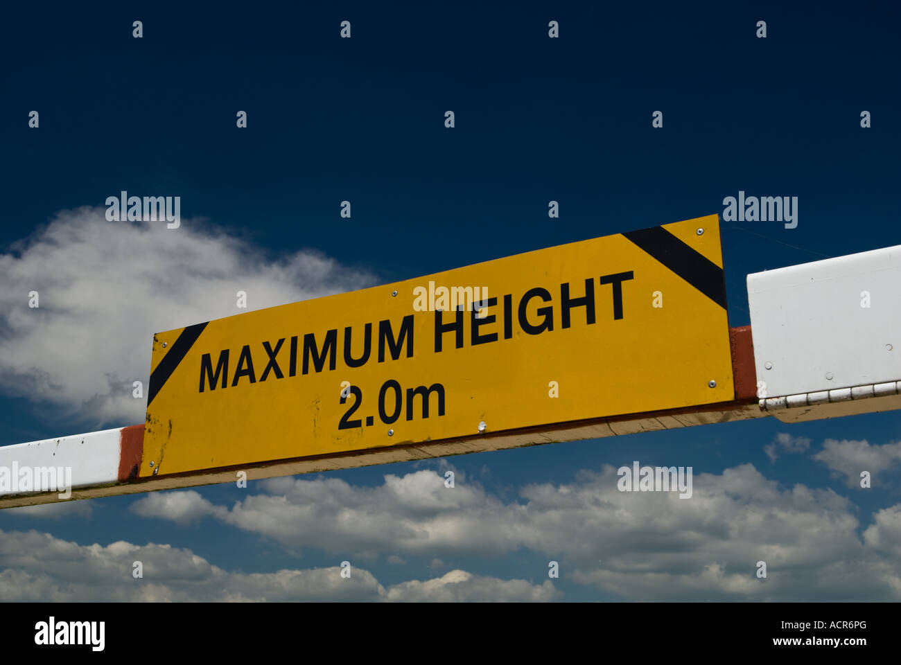 maximum height 2 0m sign at entrance to car park with a deep blue sky ...