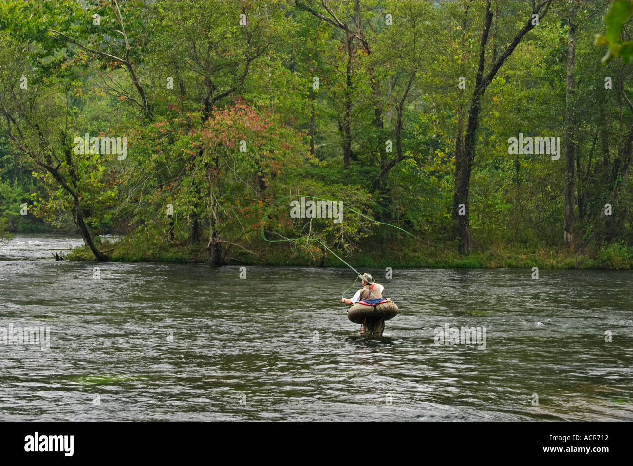 Fly Fisherman in float tube trout fishing the Hiwassee River Tennessee ...