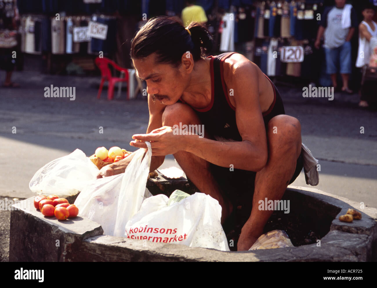Man sifting through garbage Manila Philippines Stock Photo - Alamy
