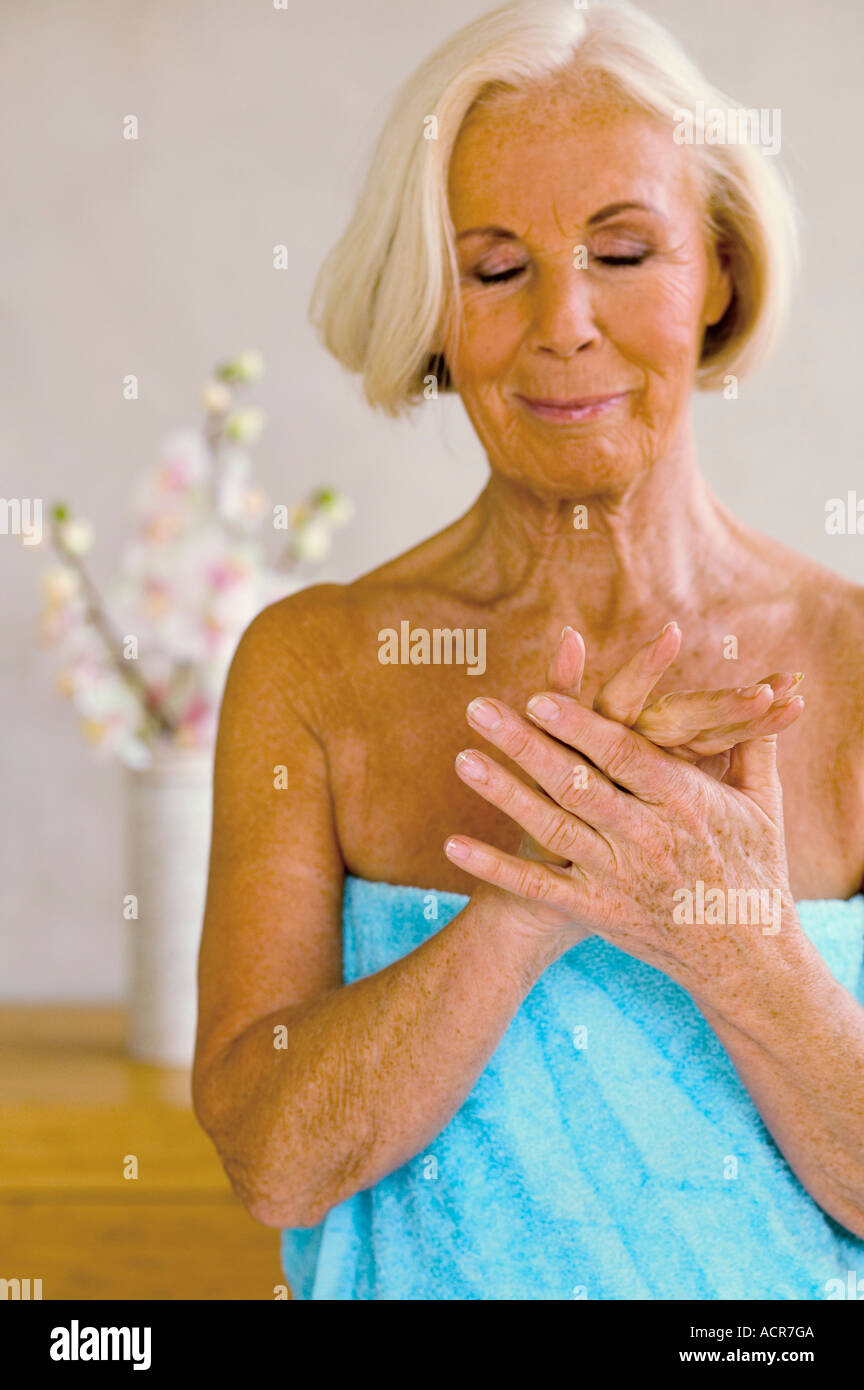 Senior woman wrapped in towel, eyes closed, smiling, portrait Stock ... Senior woman wrapped in towel, eyes closed, smiling, portrait Stock ...
