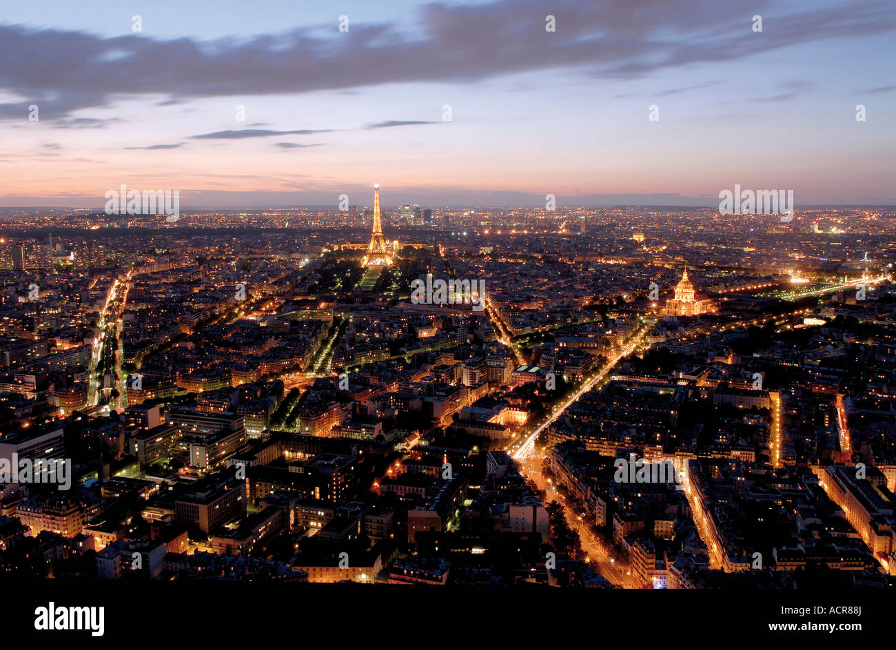 Paris, France cityscape at sunset showing streetlights and Eiffel Tower ...