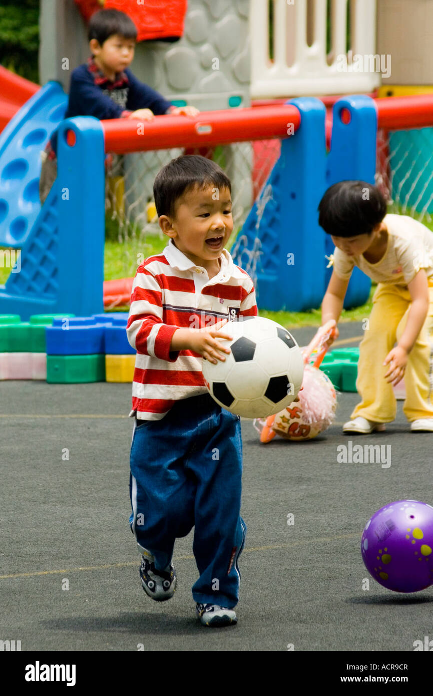 Boy Running with Ball Upscale Preschool Daycare Shanghai China Stock ...