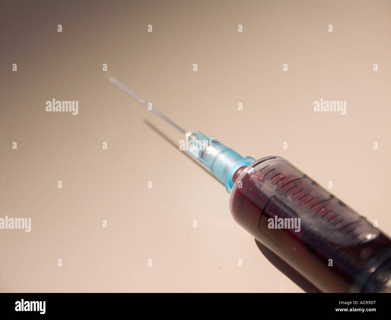 syringe blood on a white background Stock Photo - Alamy