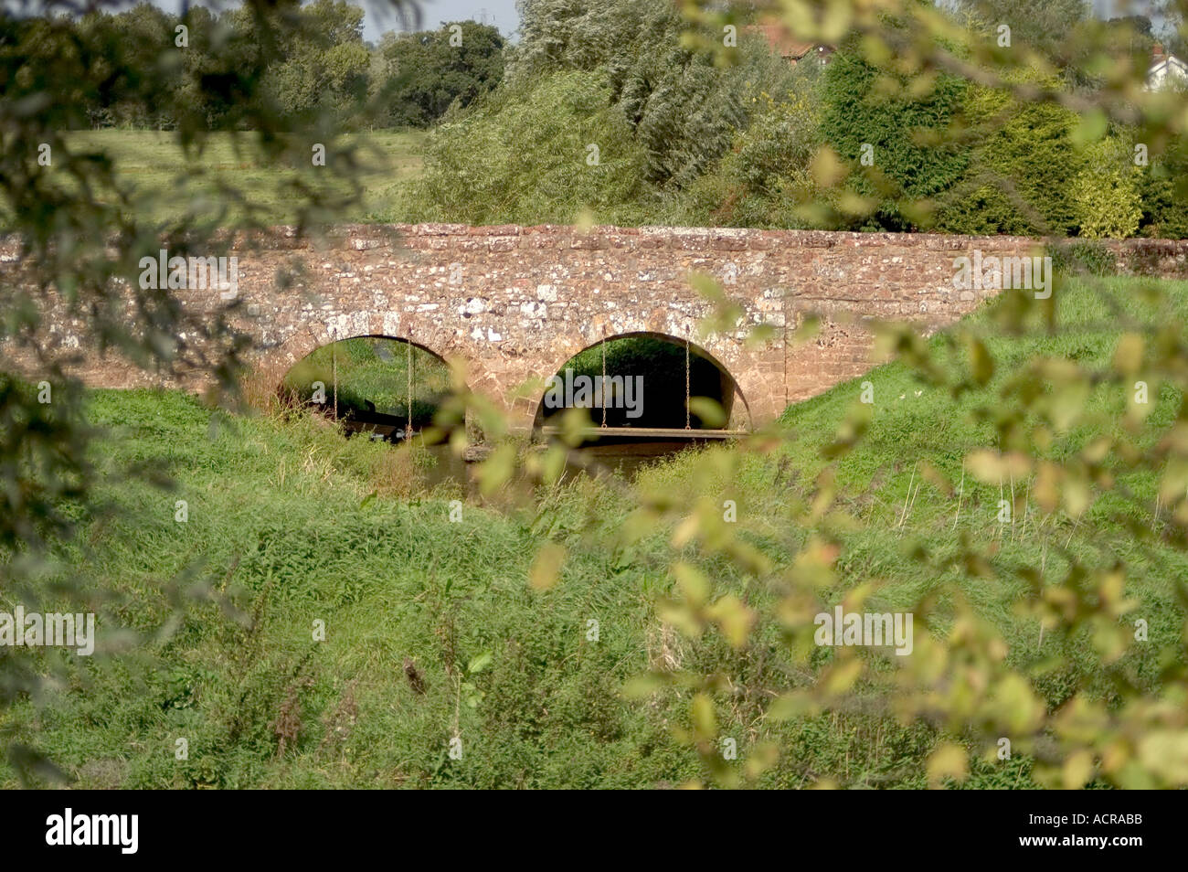 small arch bridge in a typical rural country scene Stock Photo - Alamy
