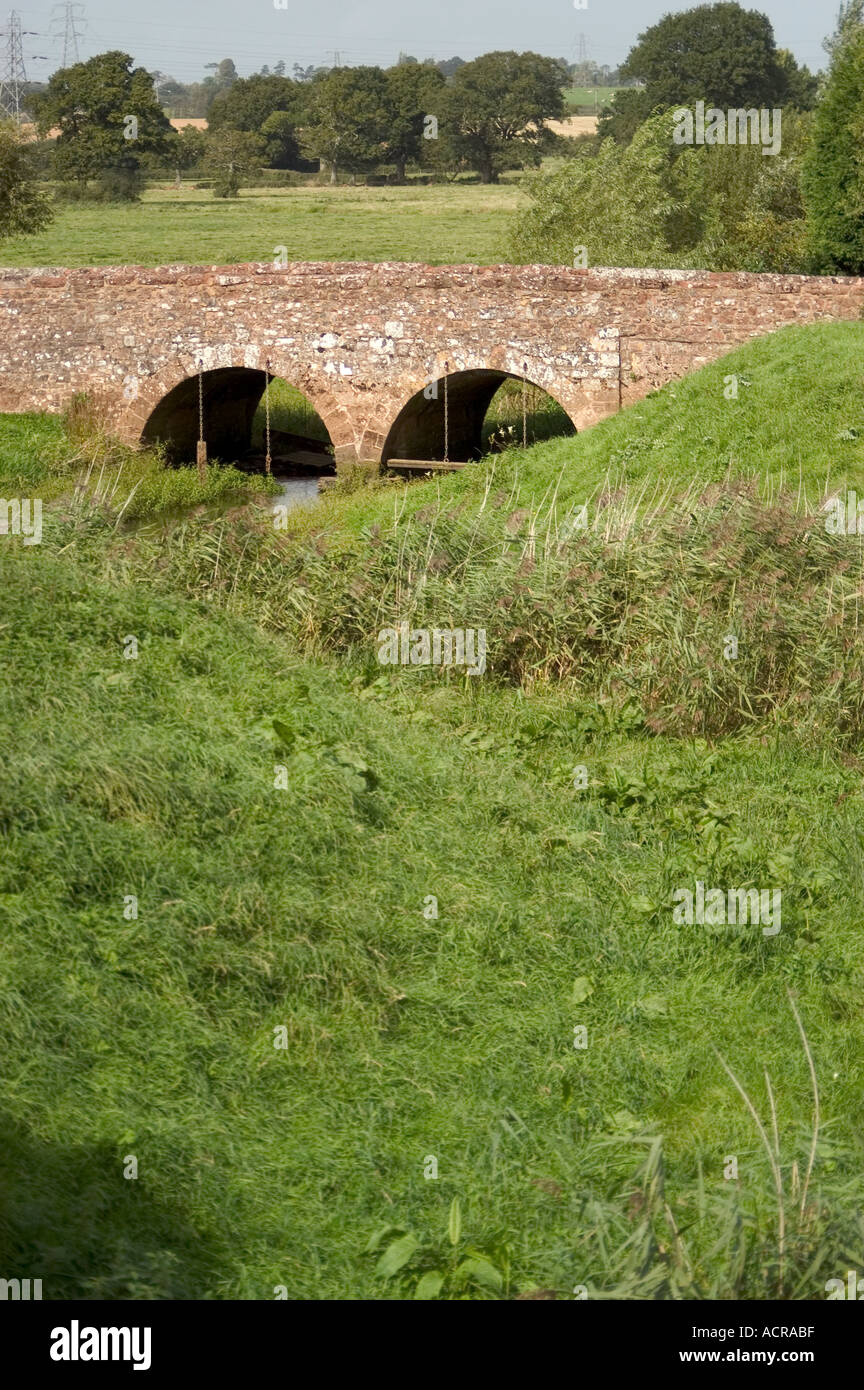 small arch bridge in a typical rural country scene Stock Photo - Alamy
