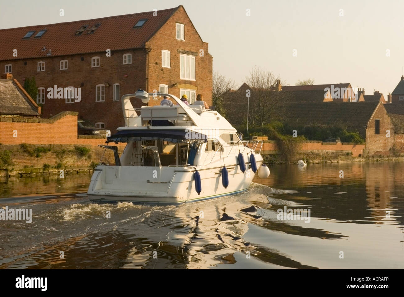 A white cruiser glides along the River Trent at Newark,England Stock ...