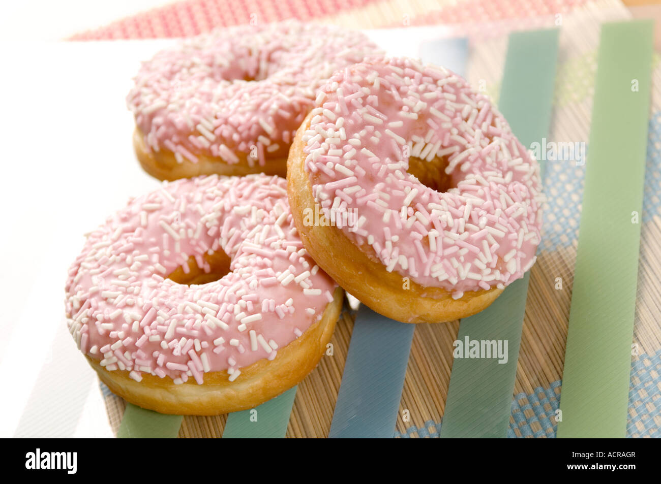 three doughnuts on the breakfast table Stock Photo - Alamy
