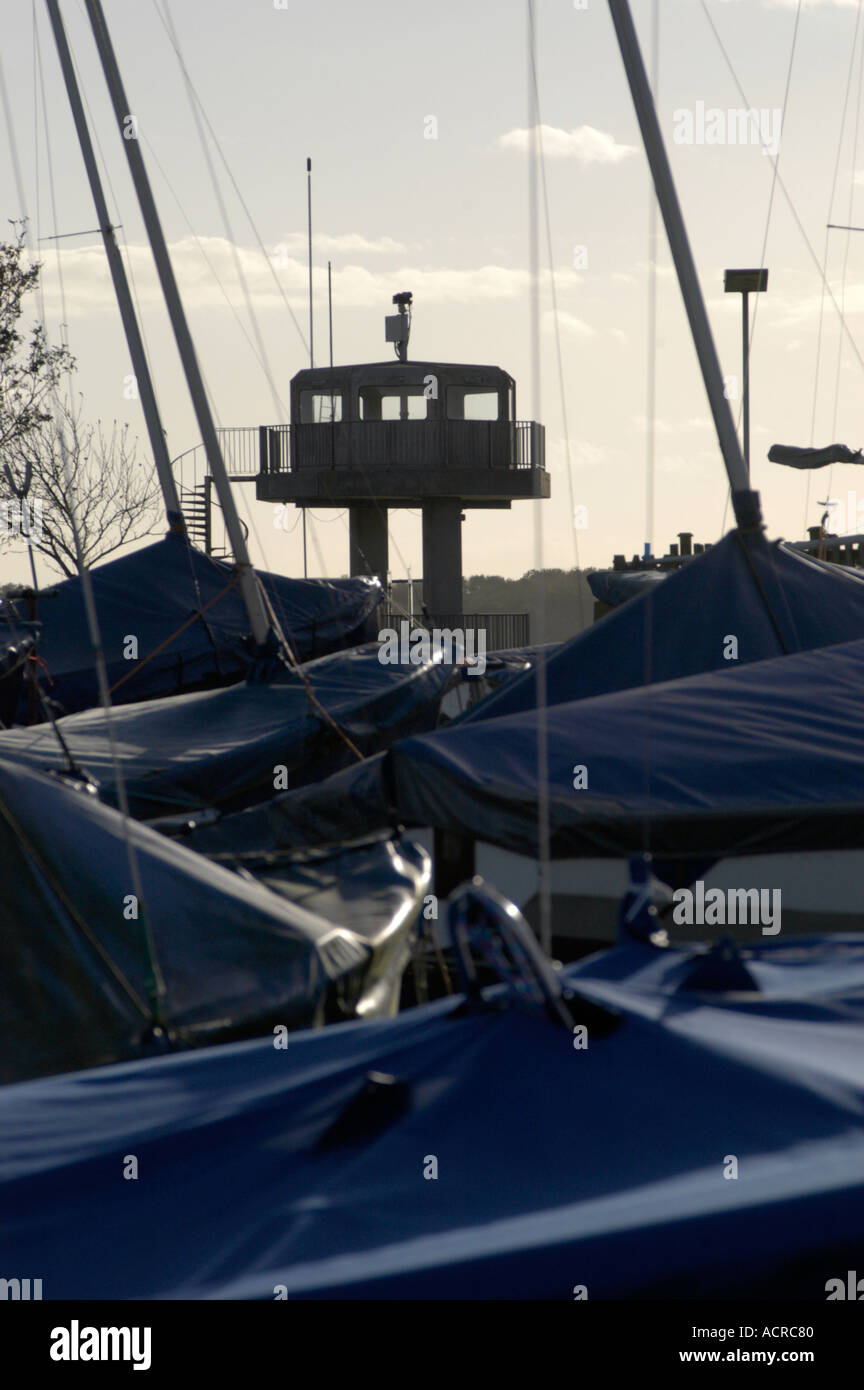 boats stored beneath the watchtower Stock Photo - Alamy