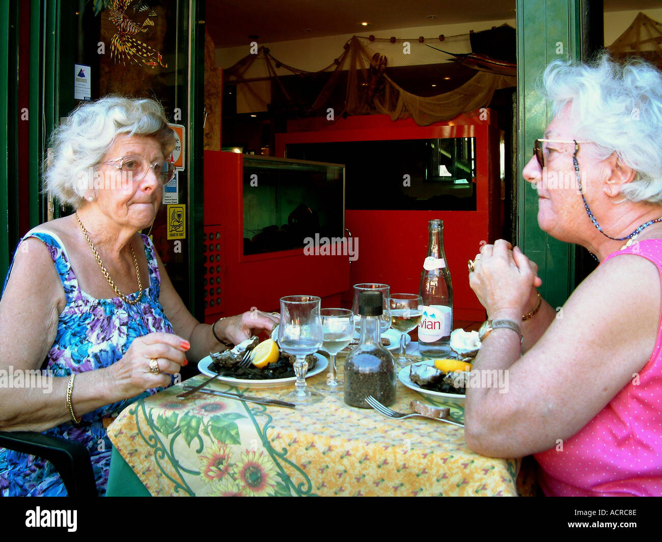 Two ladies dining at a fish restaurant in the Old Town area of Nice ...