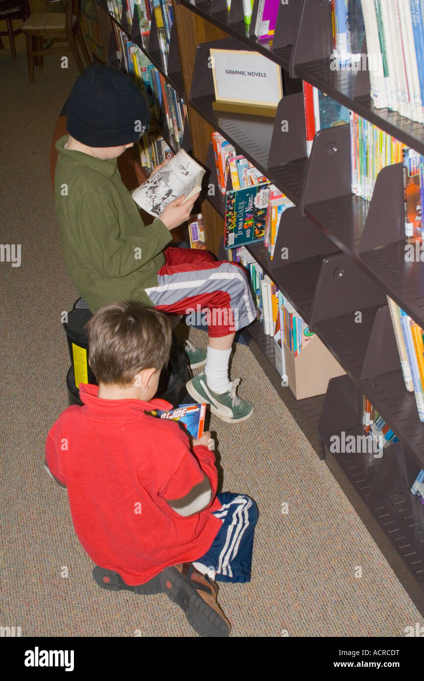 Brothers age 7 and 4 reading books at the library. James J. Hill ...