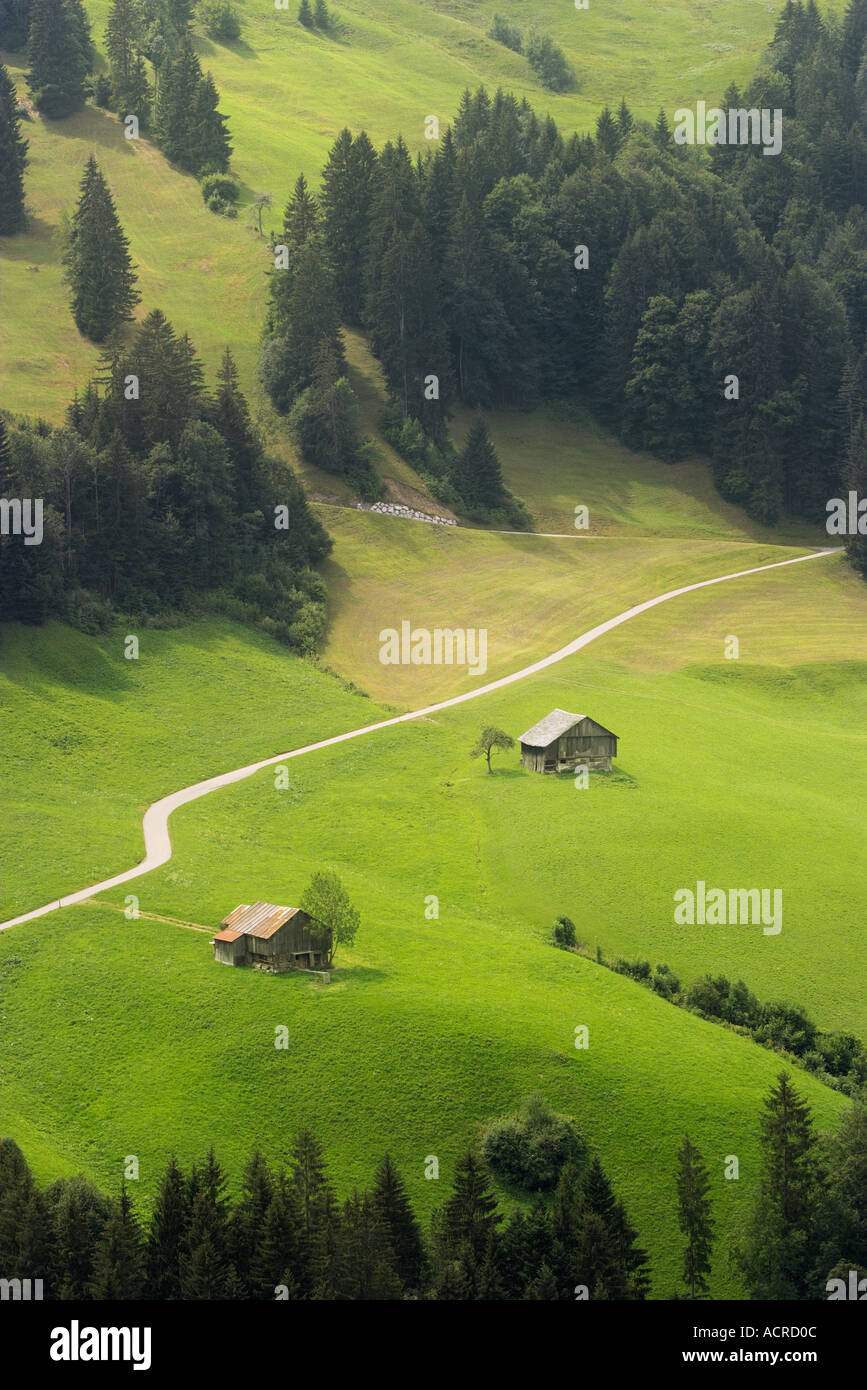 Traditional alpine barns on a hill Switzerland Stock Photo - Alamy