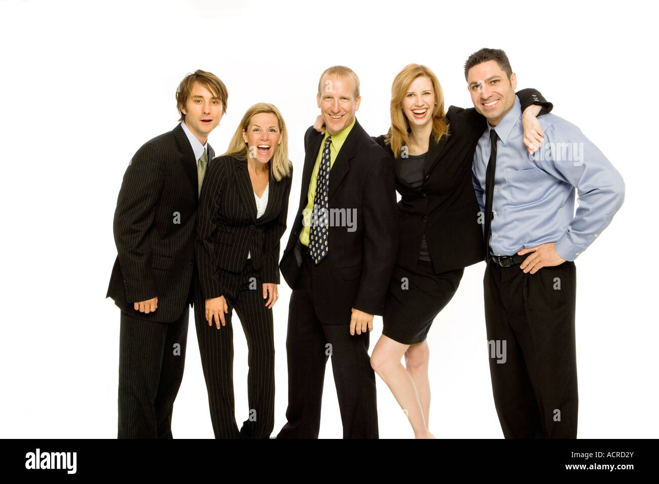 Four business people stand together as a team Stock Photo - Alamy