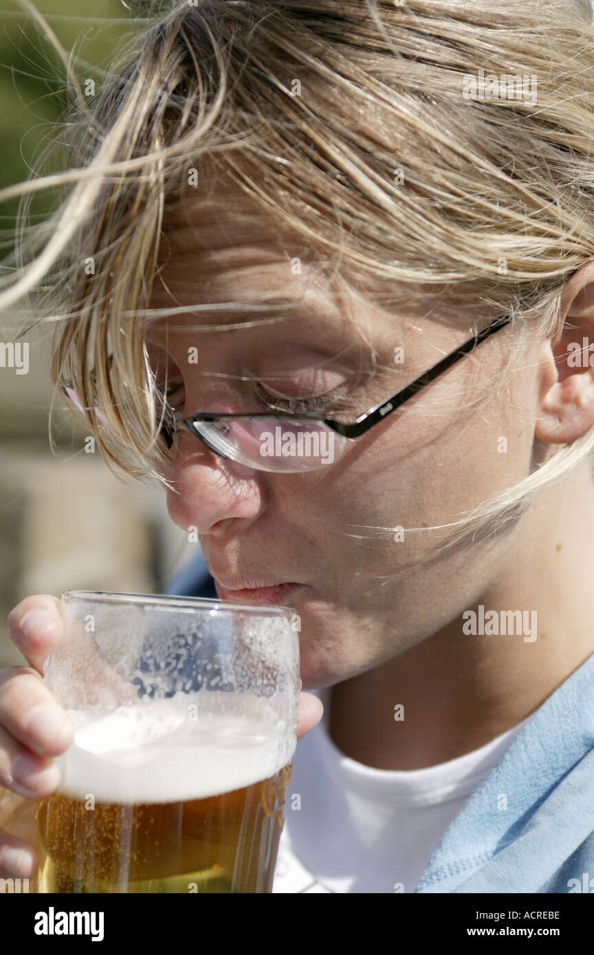 Woman drinking pint of lager hi-res stock photography and images - Alamy
