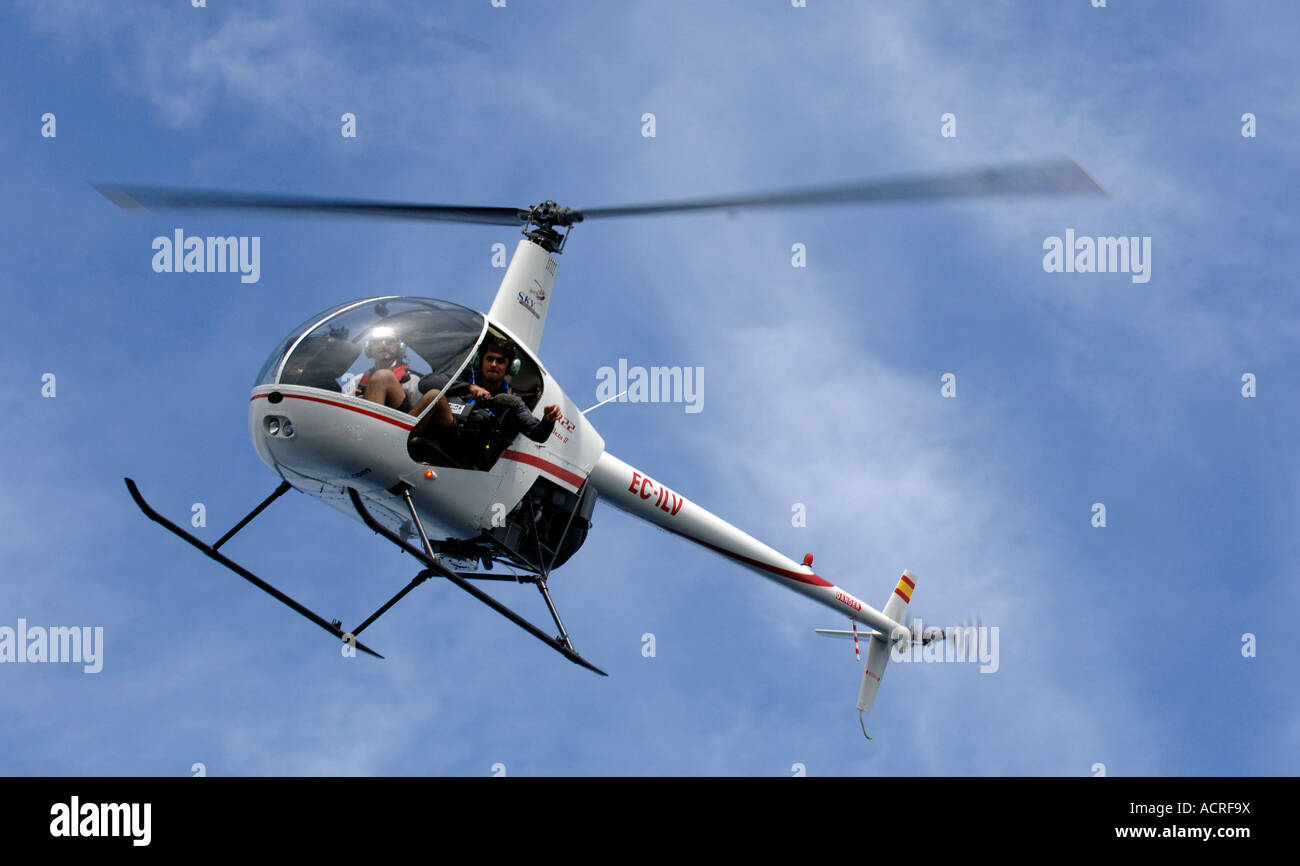 Robinson R22 helicopter, with Cameraman Stock Photo - Alamy