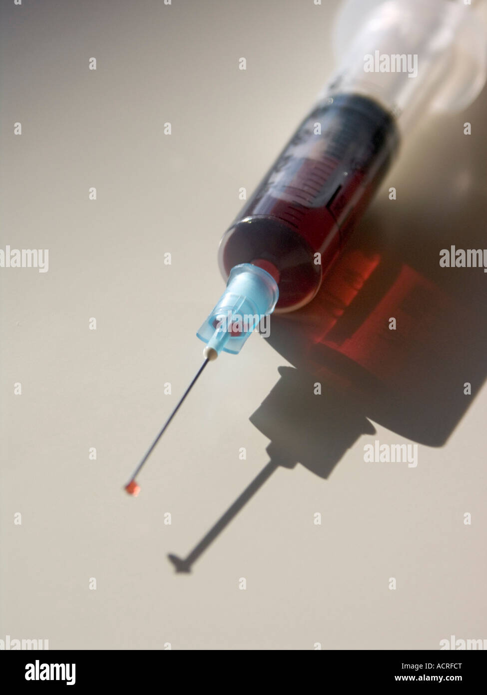 syringe blood on a white background Stock Photo - Alamy