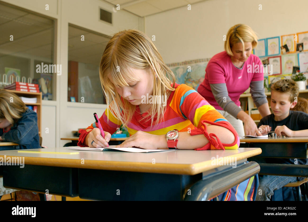 Female teacher elementary student hi-res stock photography and images ...