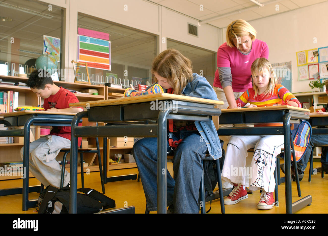 Female teacher elementary school hi-res stock photography and images ...