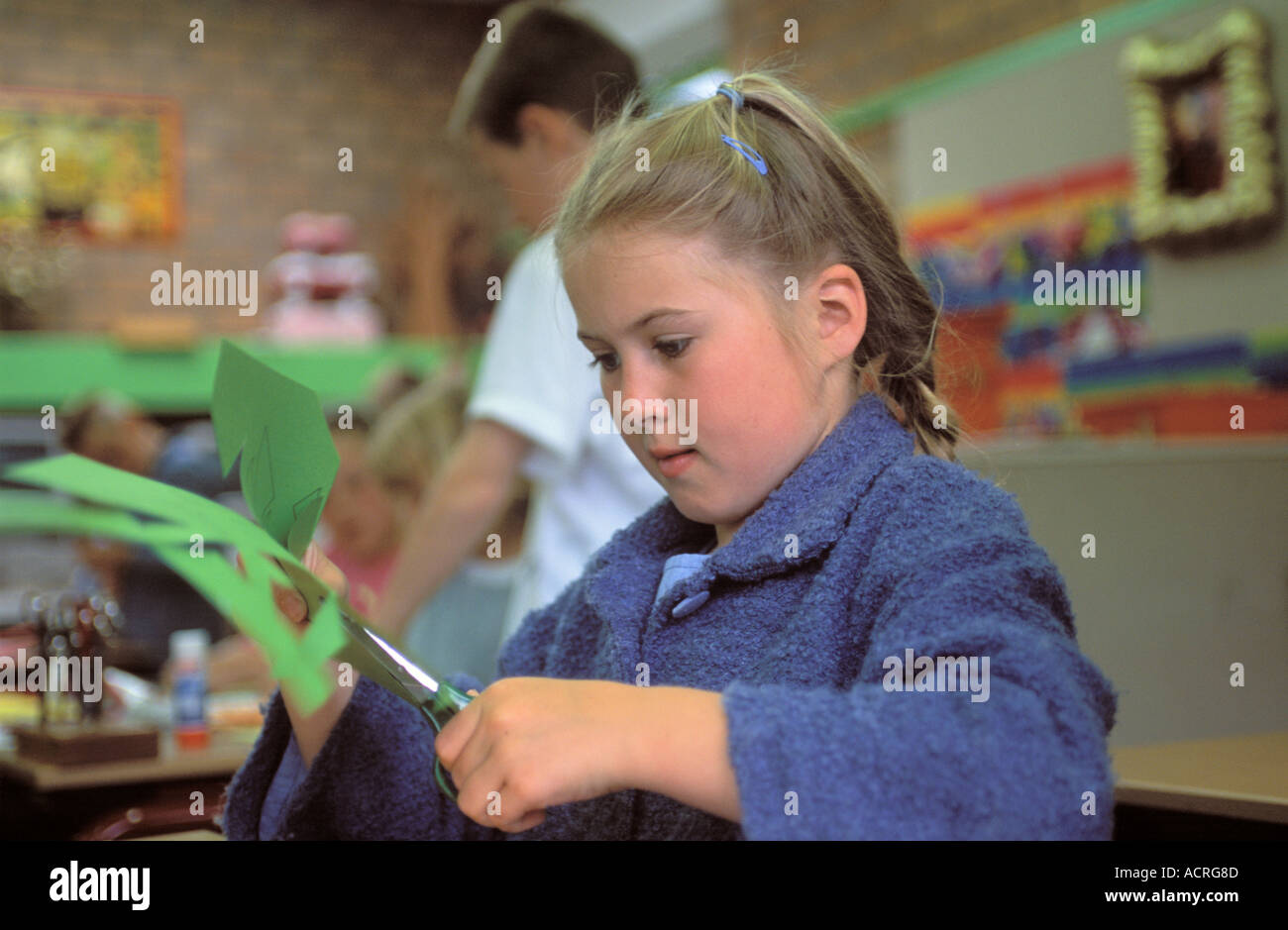 Girl at school doing handicraft Stock Photo - Alamy