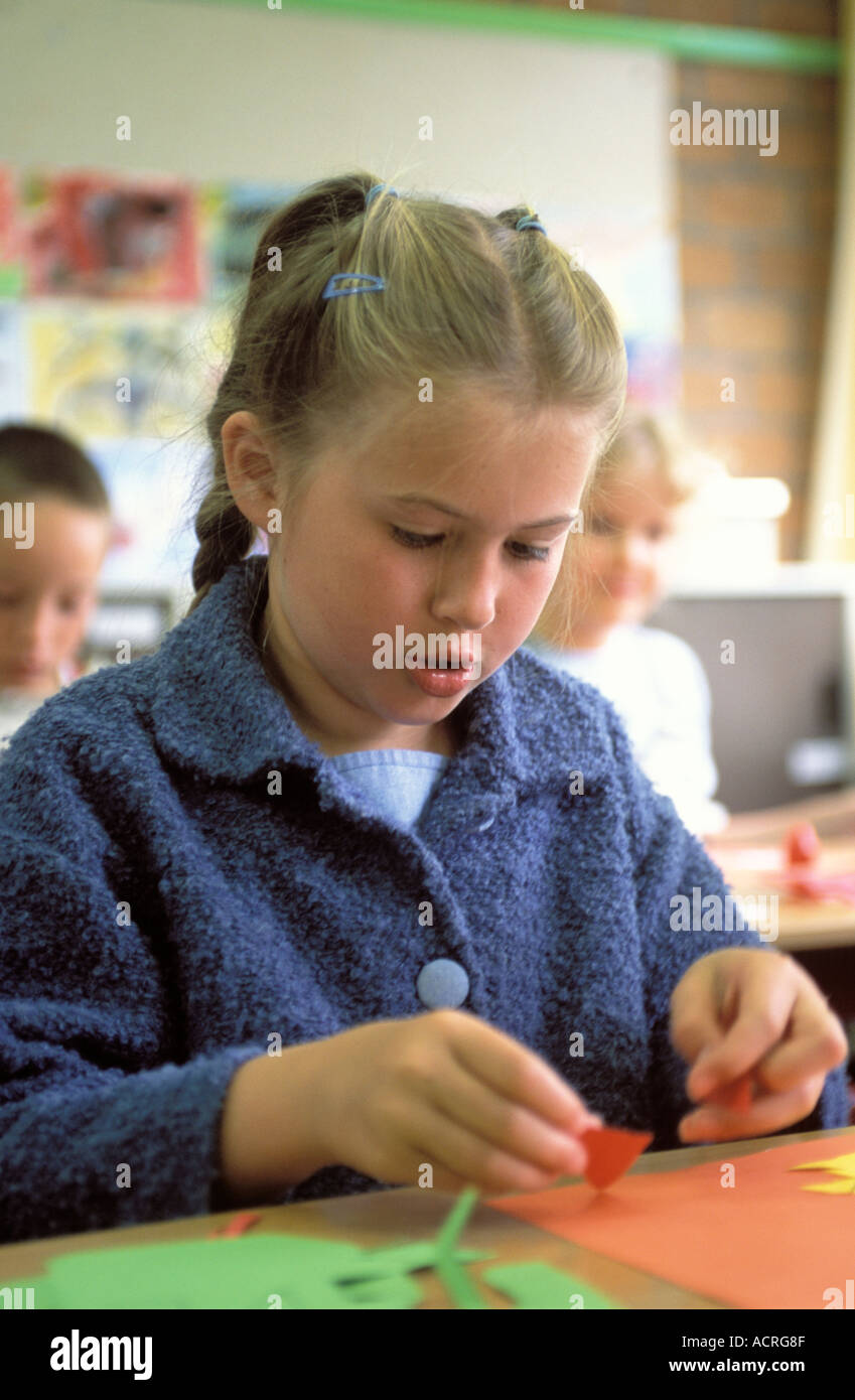 Girl at school doing handicraft Stock Photo - Alamy