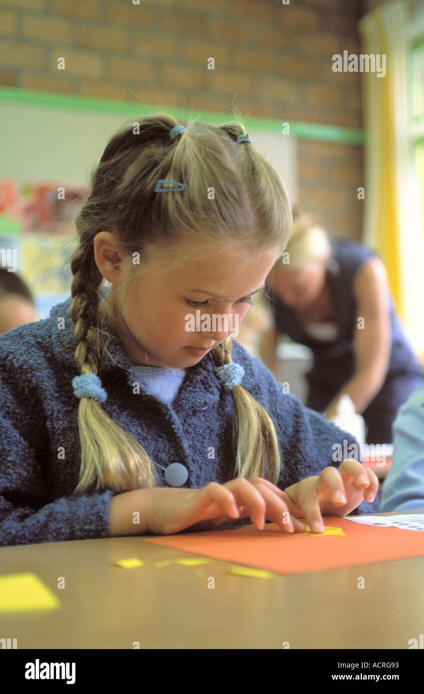 Girl at school doing handicraft Stock Photo - Alamy