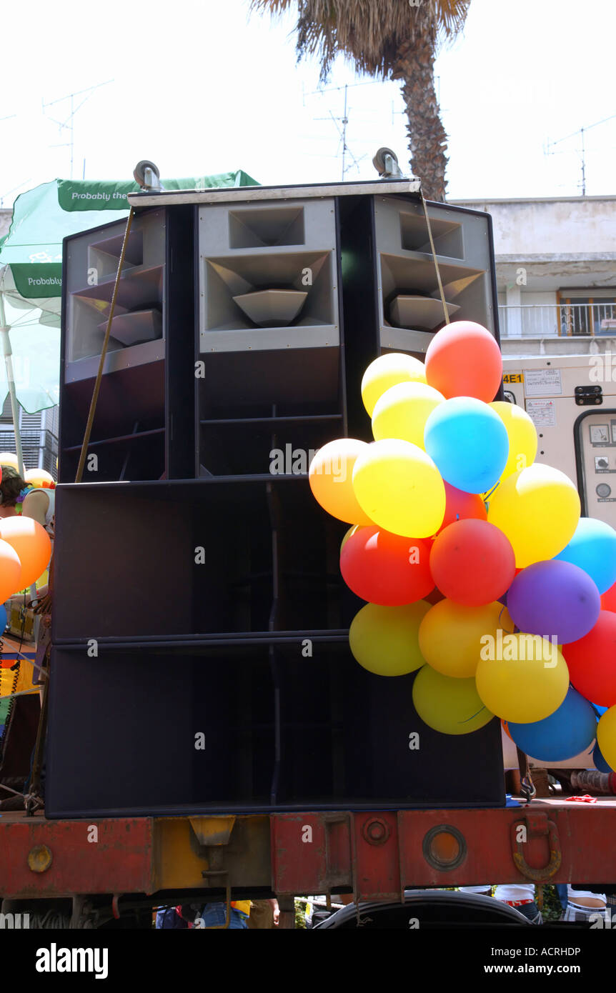 Large loud speaker decorated with balloons on a float during a festive ...