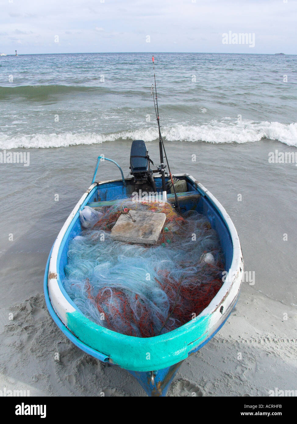 Small outboard fishing boat with rods and nets Ko Samet Thailand Stock ...