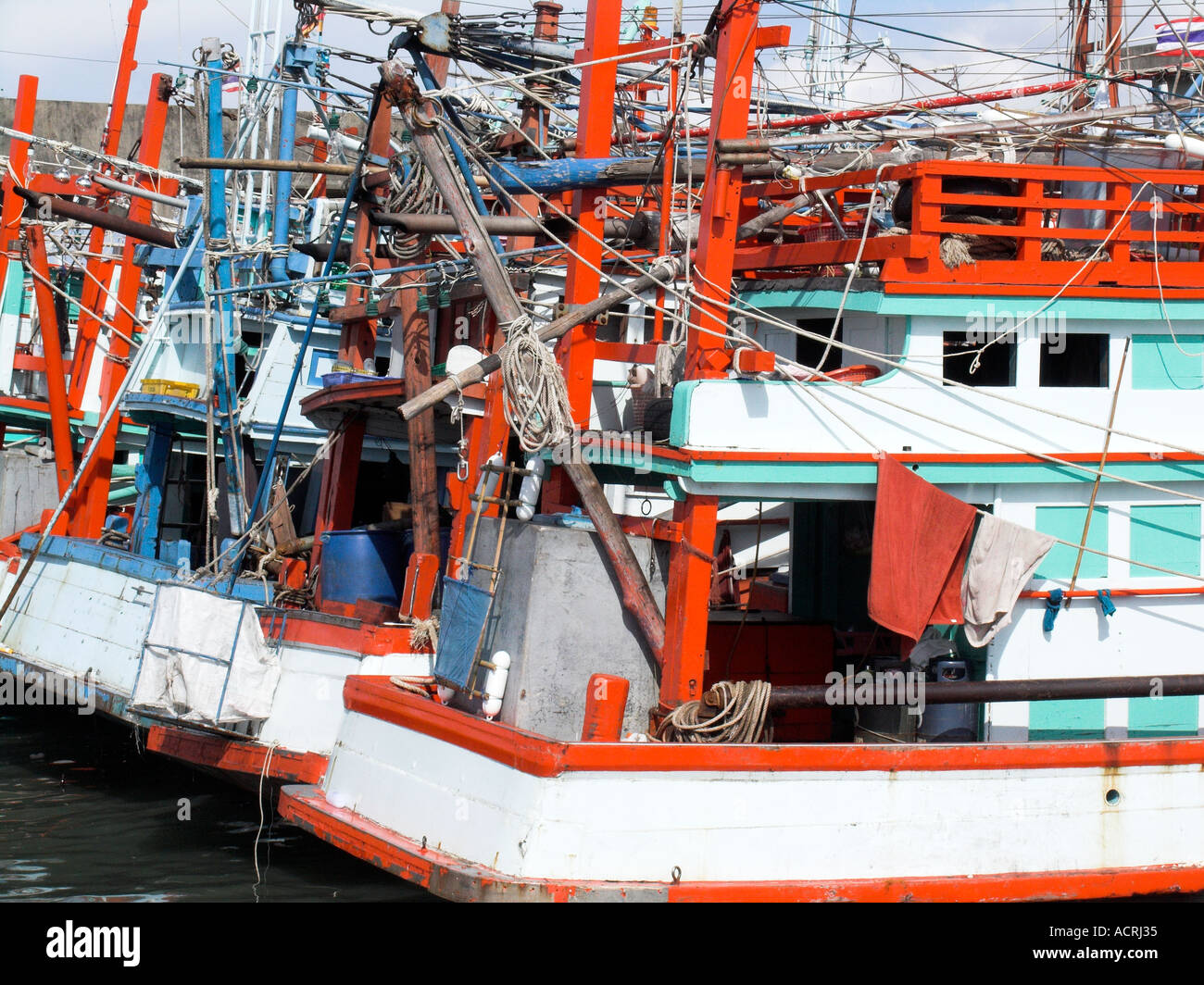 Fishing boats at Ban Pe port Thailand Stock Photo - Alamy