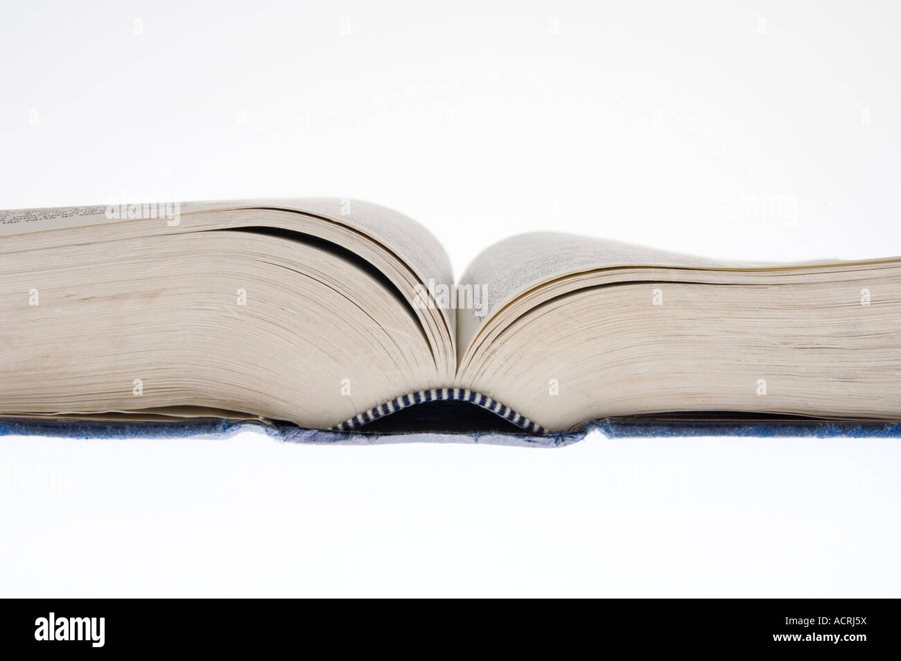 An open hardback book open on a white background Stock Photo - Alamy