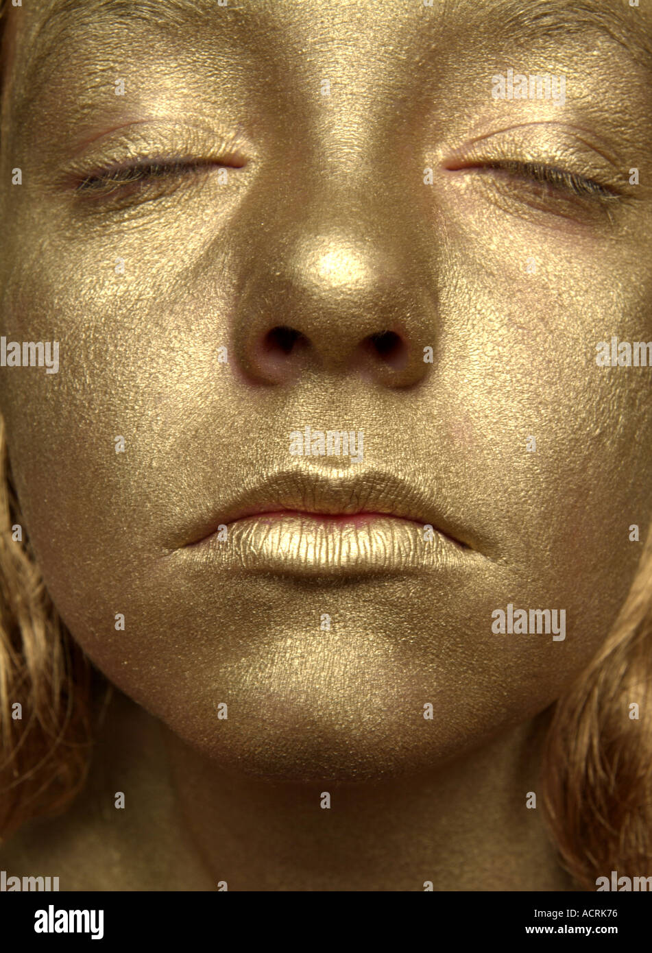 half gold face girl neck in view Stock Photo - Alamy