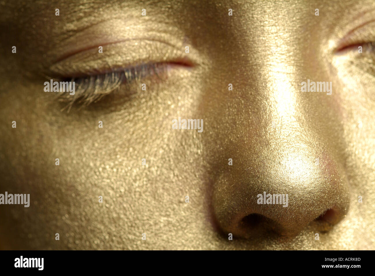 half gold face girl eye closed nose very closeup saturated Stock Photo ...