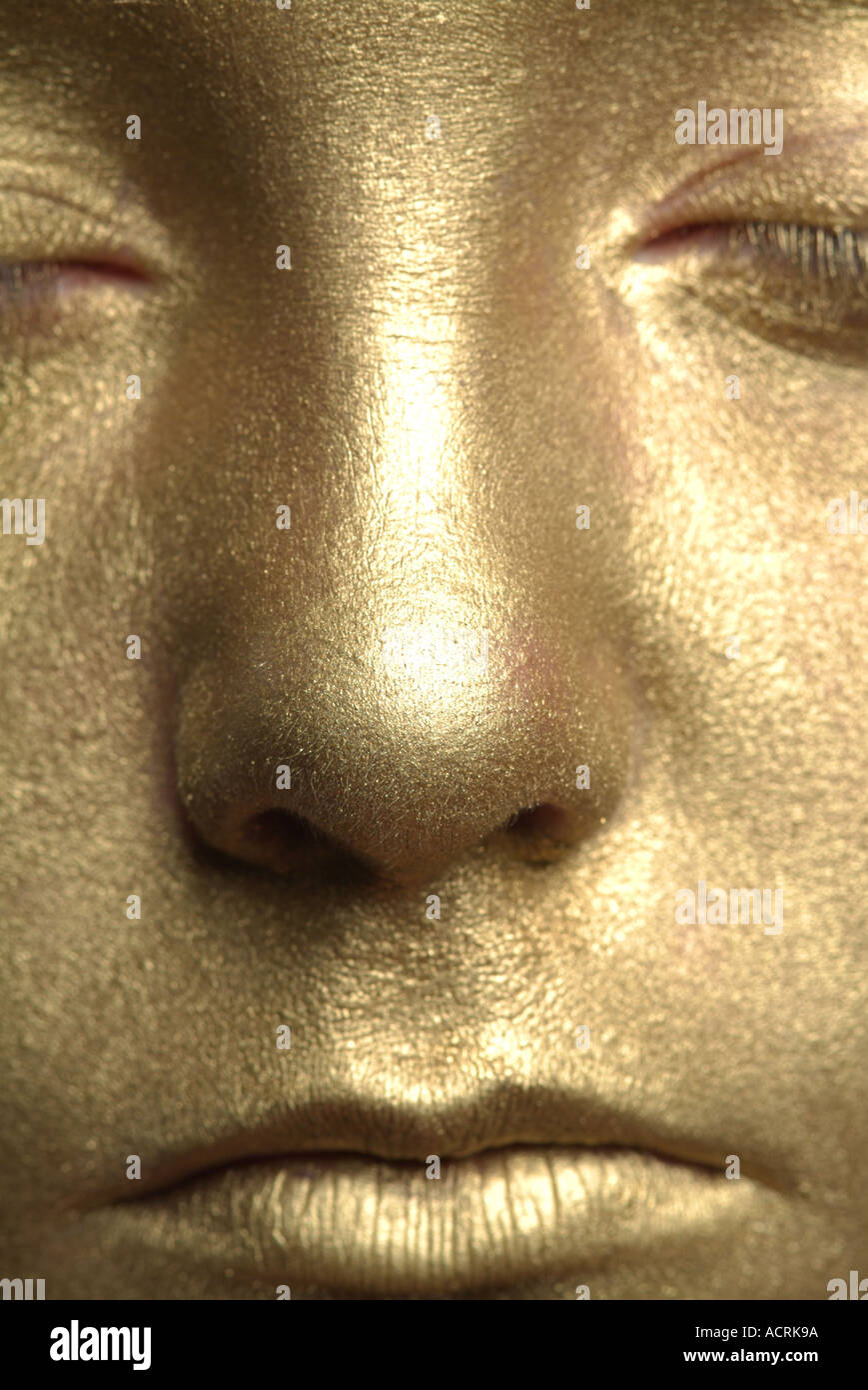 half gold face girl eye closed nose mouth very closeup Stock Photo - Alamy