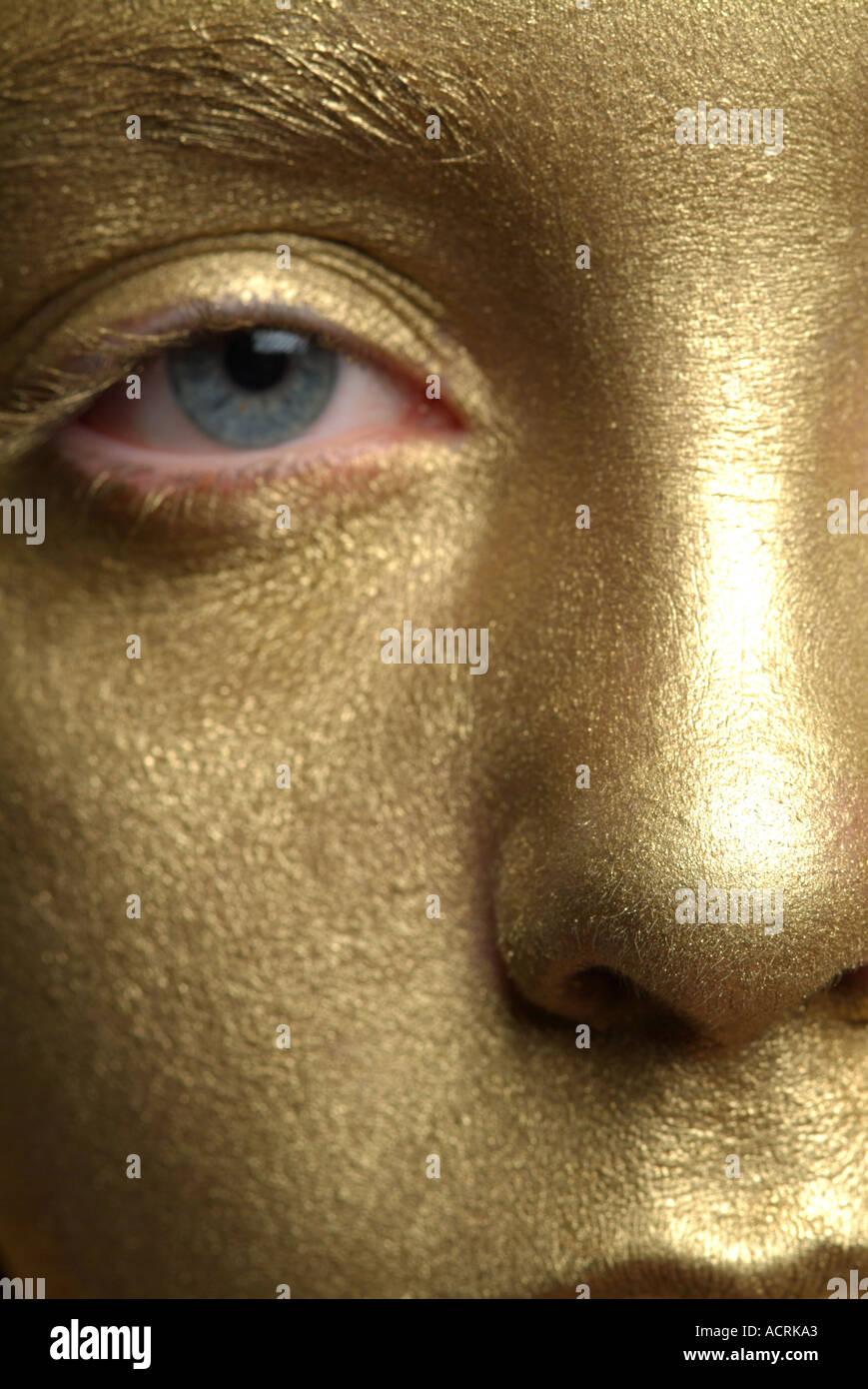 half gold face girl eye open nose mouth closeup Stock Photo - Alamy