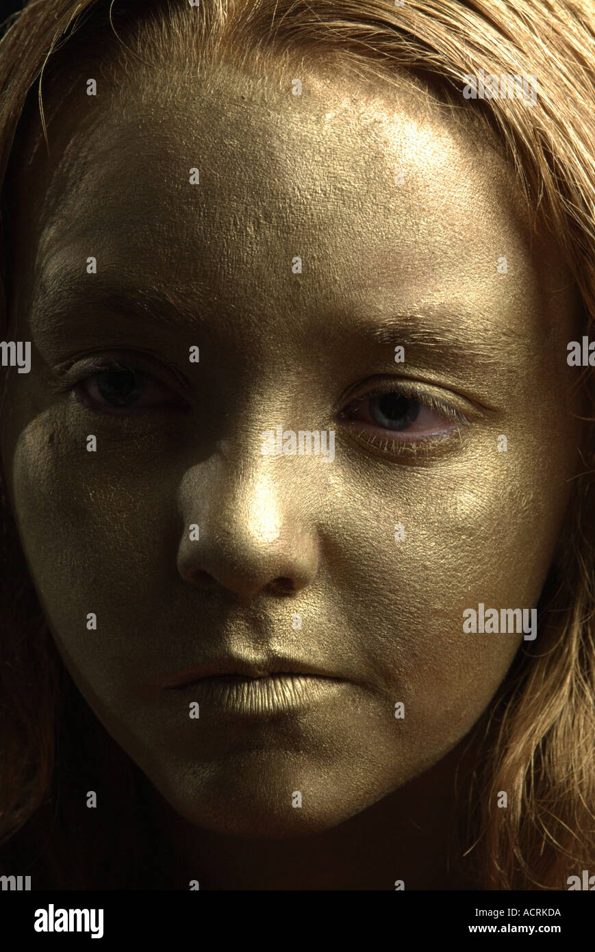 gold face girl shadow Stock Photo - Alamy