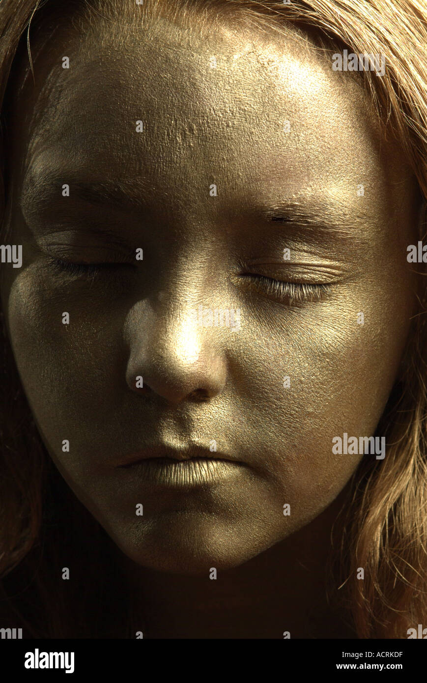 gold face girl shadow Stock Photo - Alamy
