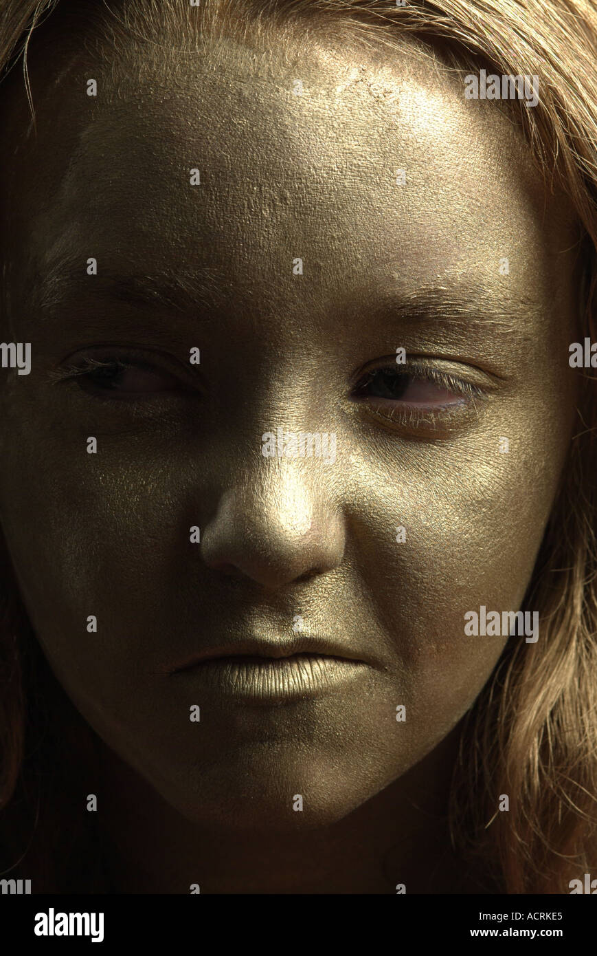 gold face girl shadow Stock Photo - Alamy