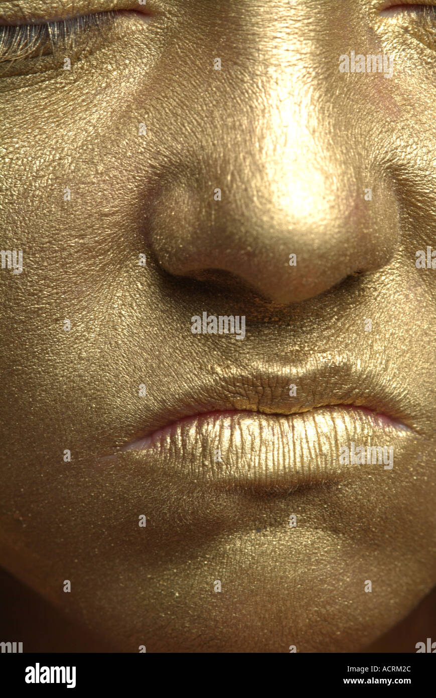 gold face girl closeup disgust contempt Stock Photo - Alamy