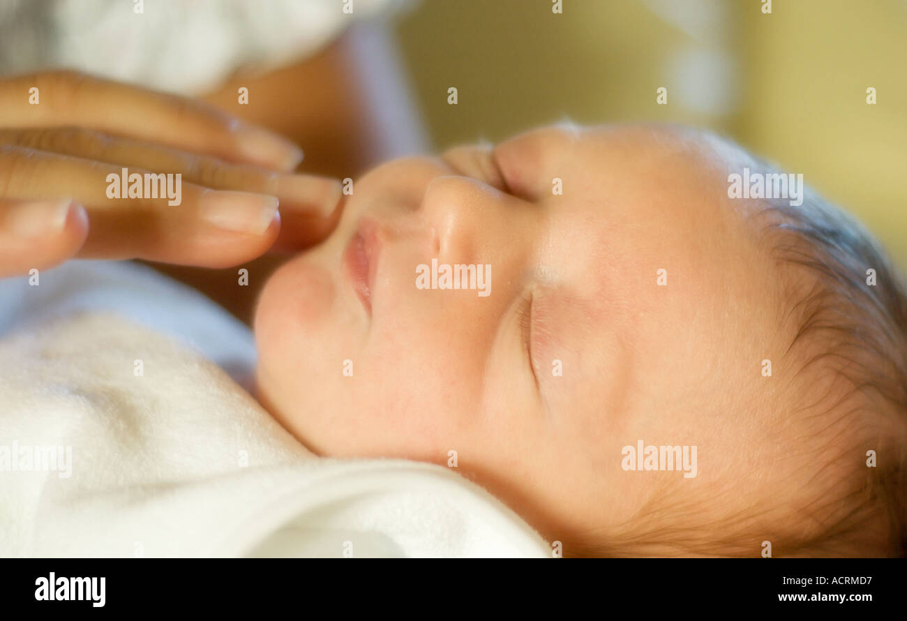 Mother soothing new born baby Stock Photo - Alamy