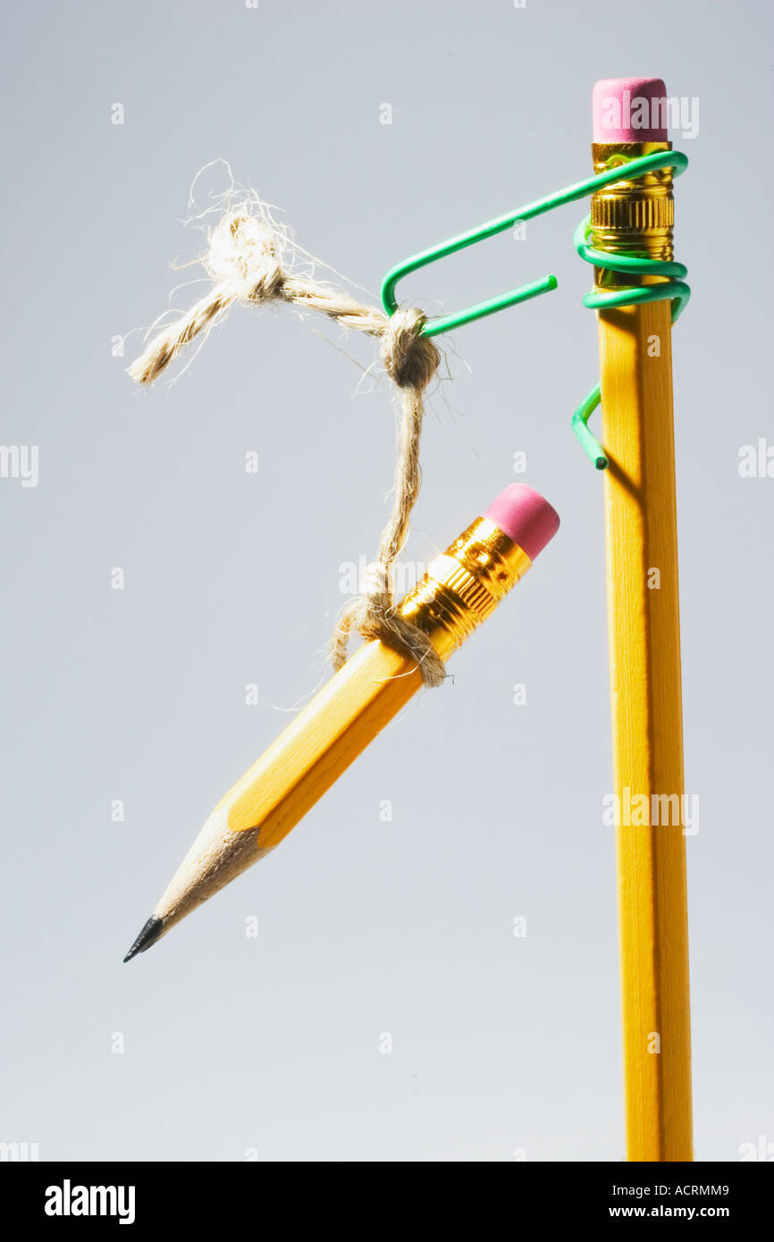 Long and Short Pencil with Paper Clip Stock Photo - Alamy
