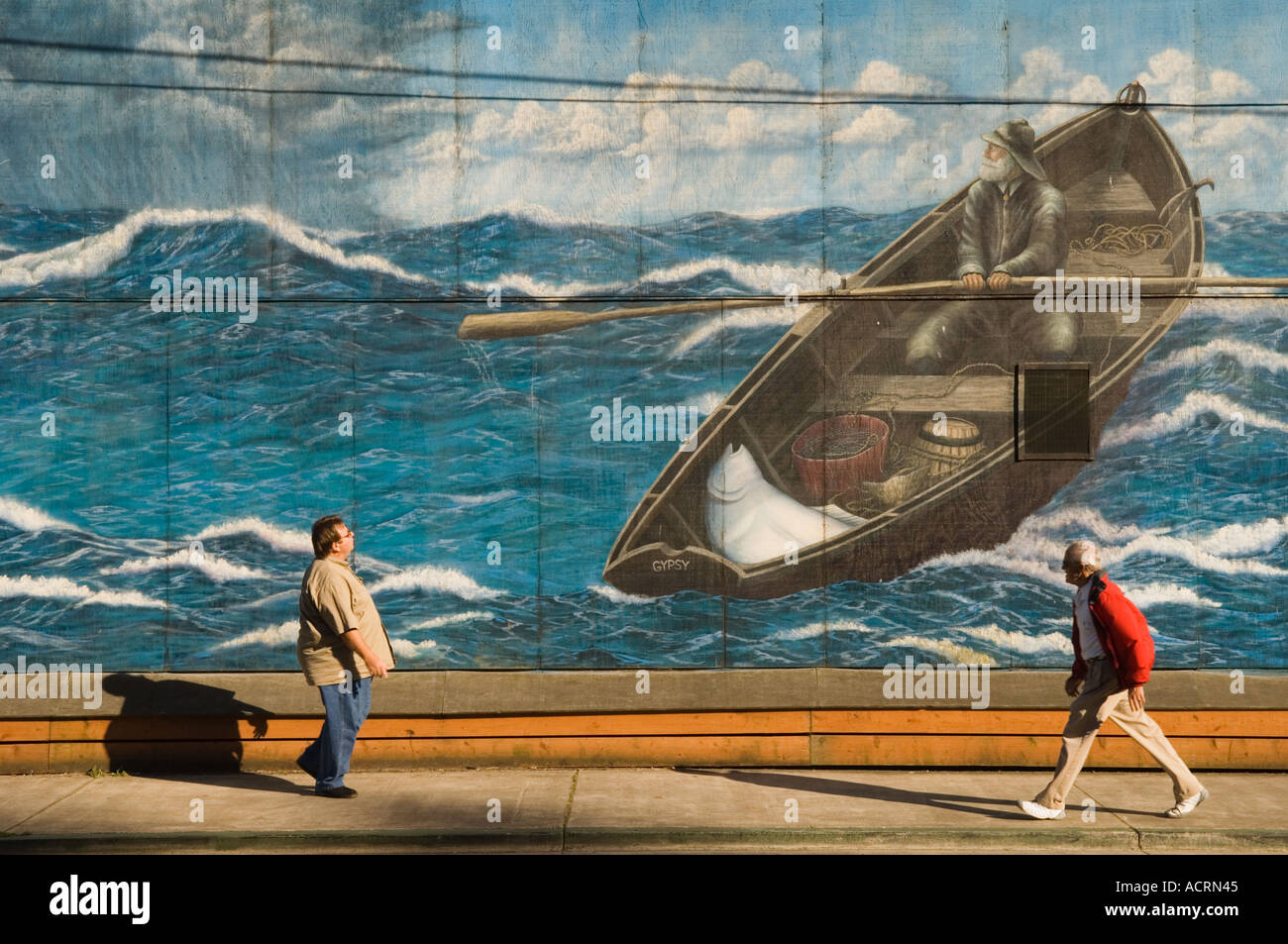 Mural on wall by Rick Chambers with two men walking by Newport Bay ...