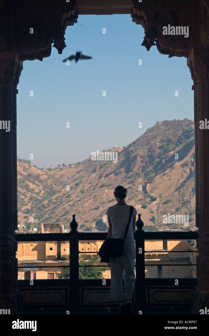 Wende Valentine gazes from through a Rajput archway at Amber Fort ...