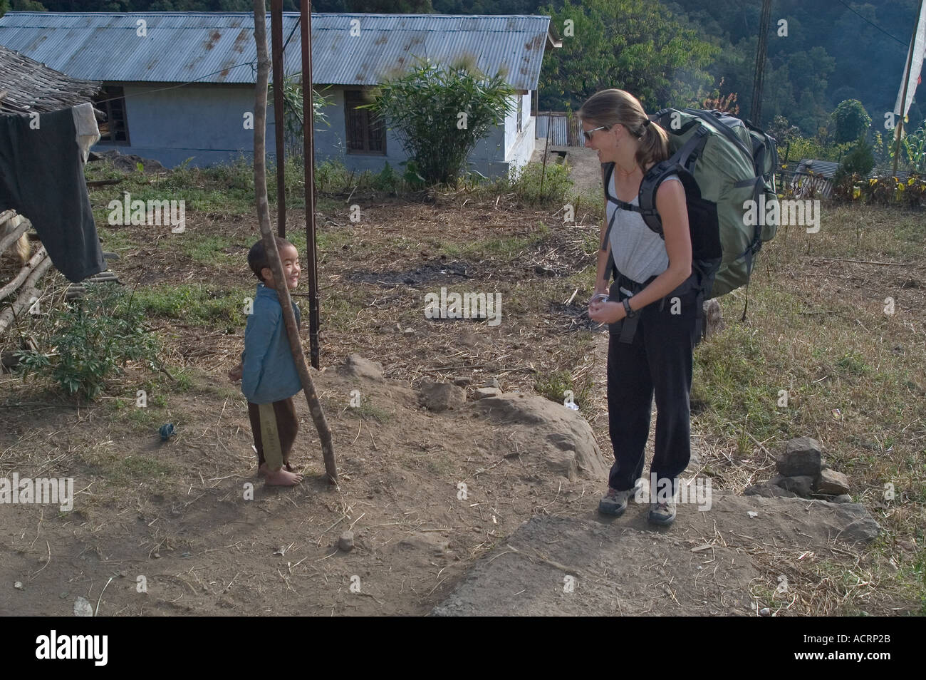 Wende Valentine chats with a Lepcha boy near Yuksom during a trek to ...