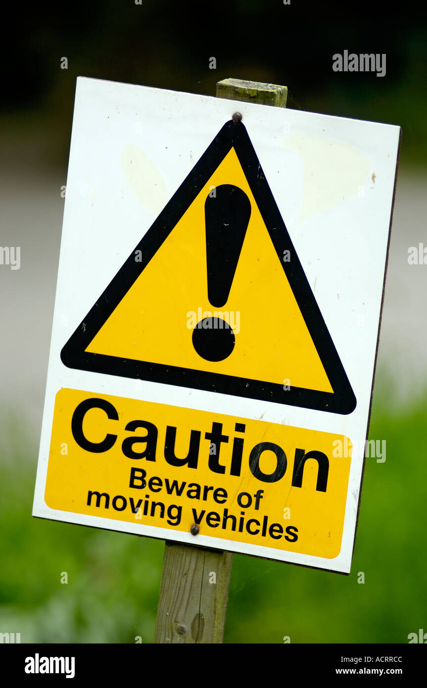 Warning sign Caution Beware of moving vehicles Stock Photo - Alamy