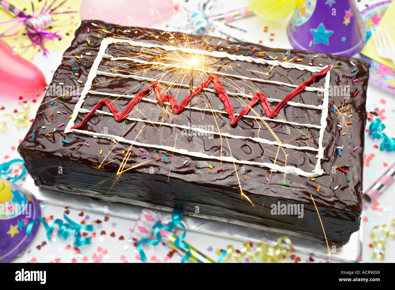 Icing graph on cake in party atmosphere Stock Photo - Alamy