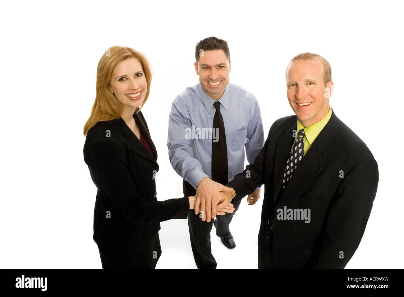 Three business people gesture teamwork Stock Photo - Alamy