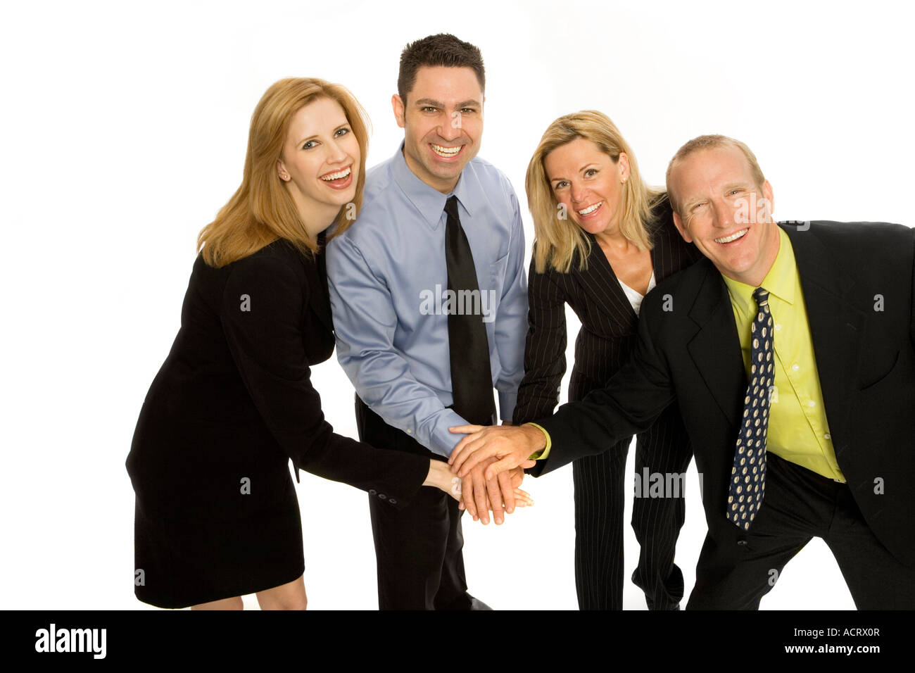 Four business people gesture teamwork together Stock Photo - Alamy