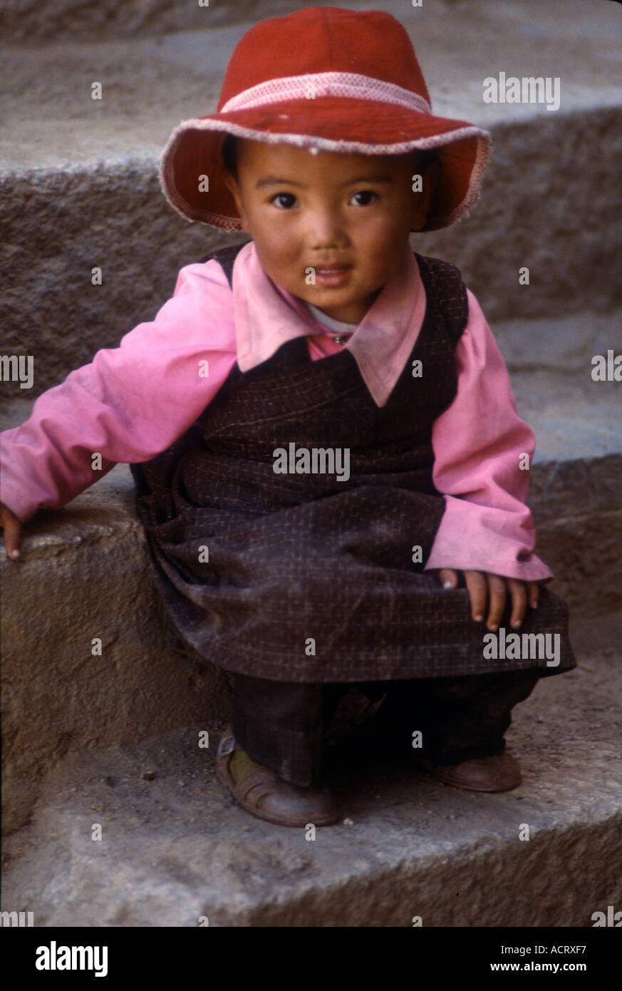 Portrait of a small Tibetan girl in Lhasa Tibet China Stock Photo - Alamy